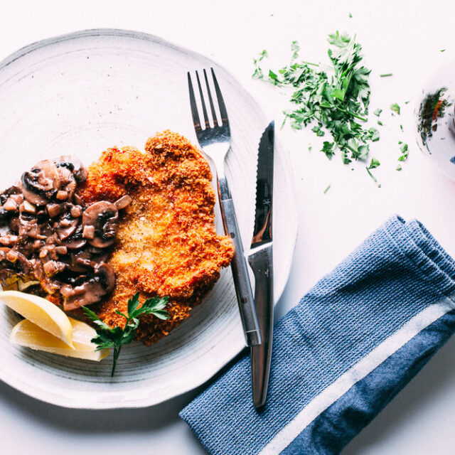 Crispy Pork Schnitzel with a Mushroom-Wine Sauce